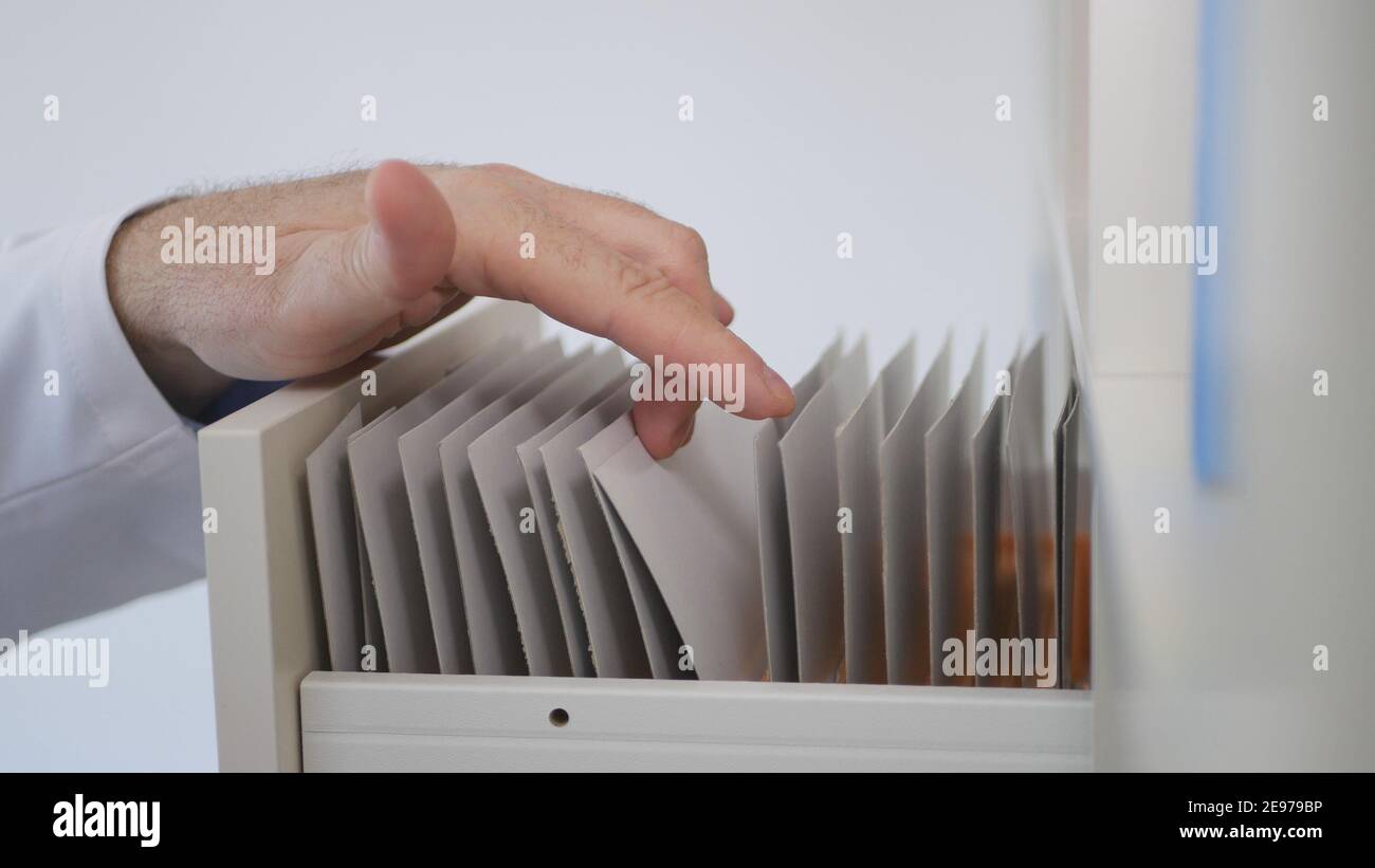 Image with a Doctor Searching Medical Records in Hospital Archive Stock ...