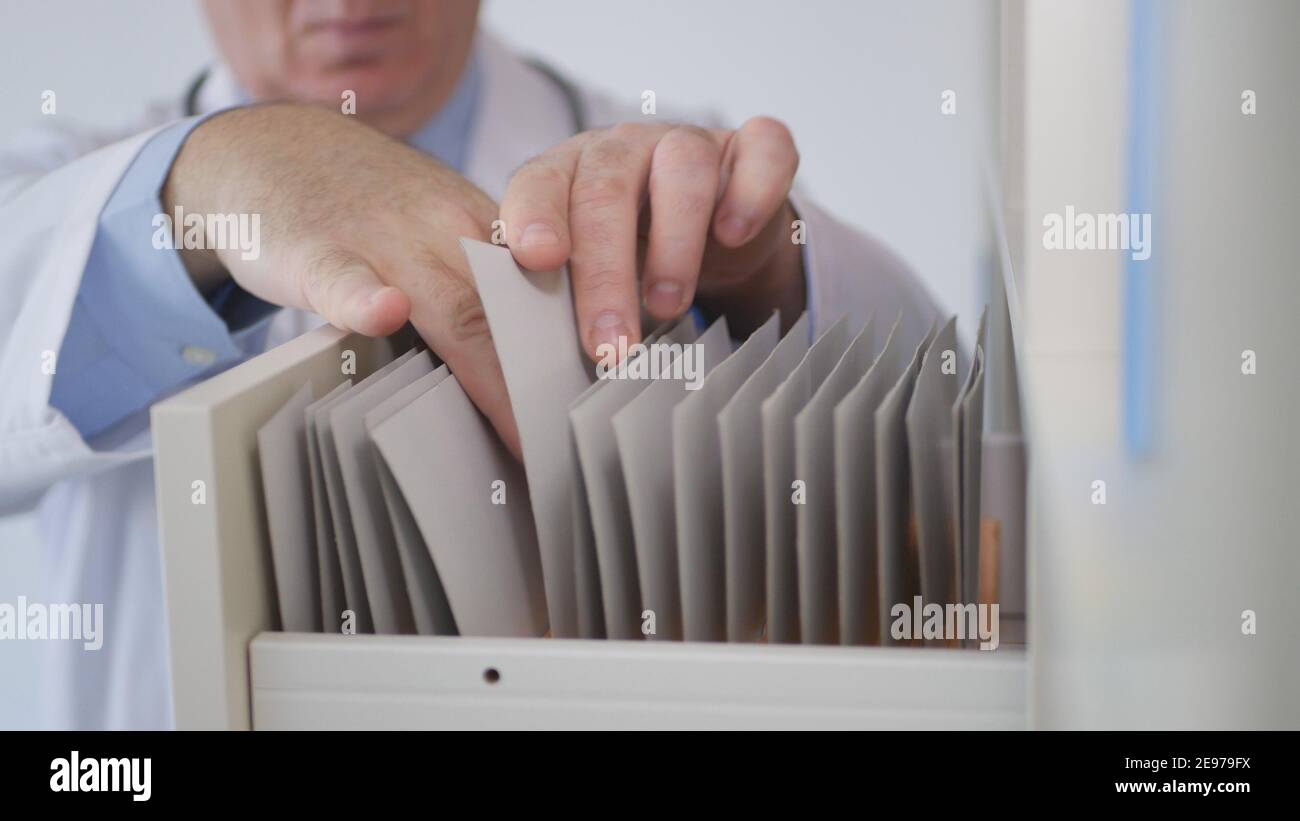 Image with a Doctor Searching Medical Records in Hospital Archive Stock ...