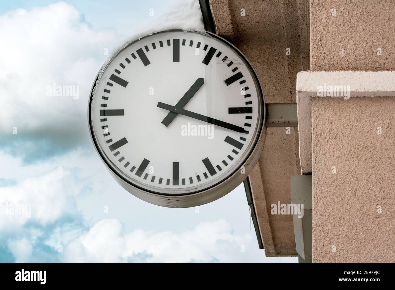 Large clock on the outside of a train station building Stock Photo - Alamy