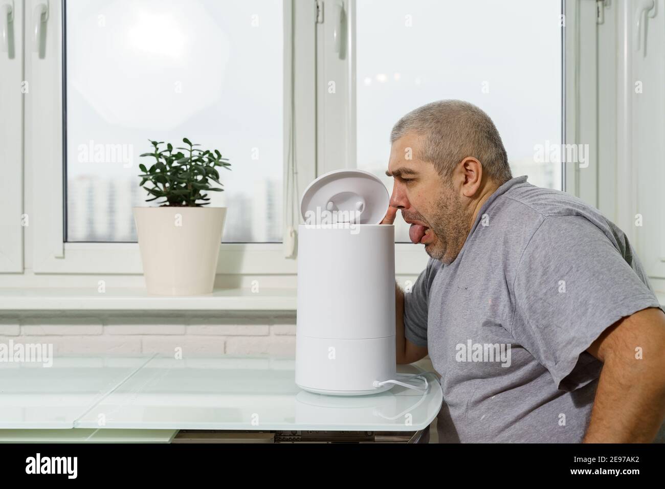 the big gray-haired man doesn't like the smell from the humidifier ...