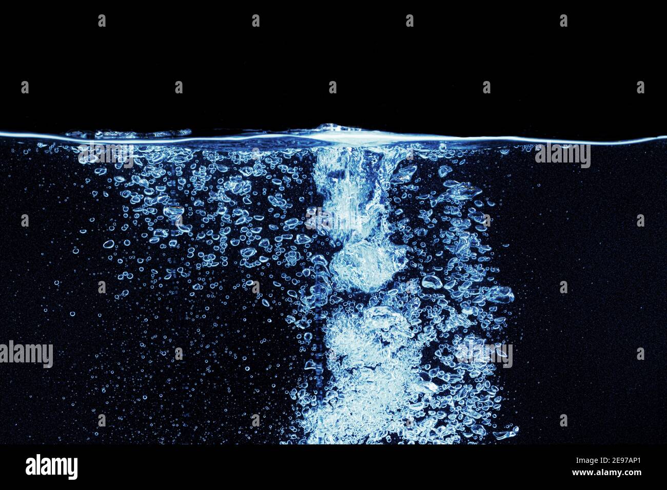 Water splash in aquarium isolated on black background Stock Photo - Alamy