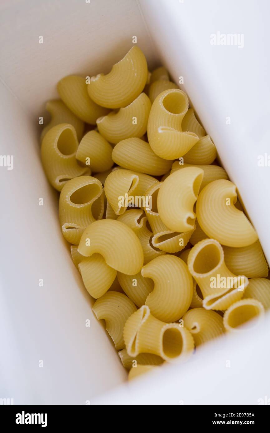 a fresh raw durum pasta in white box in kitchen Stock Photo - Alamy