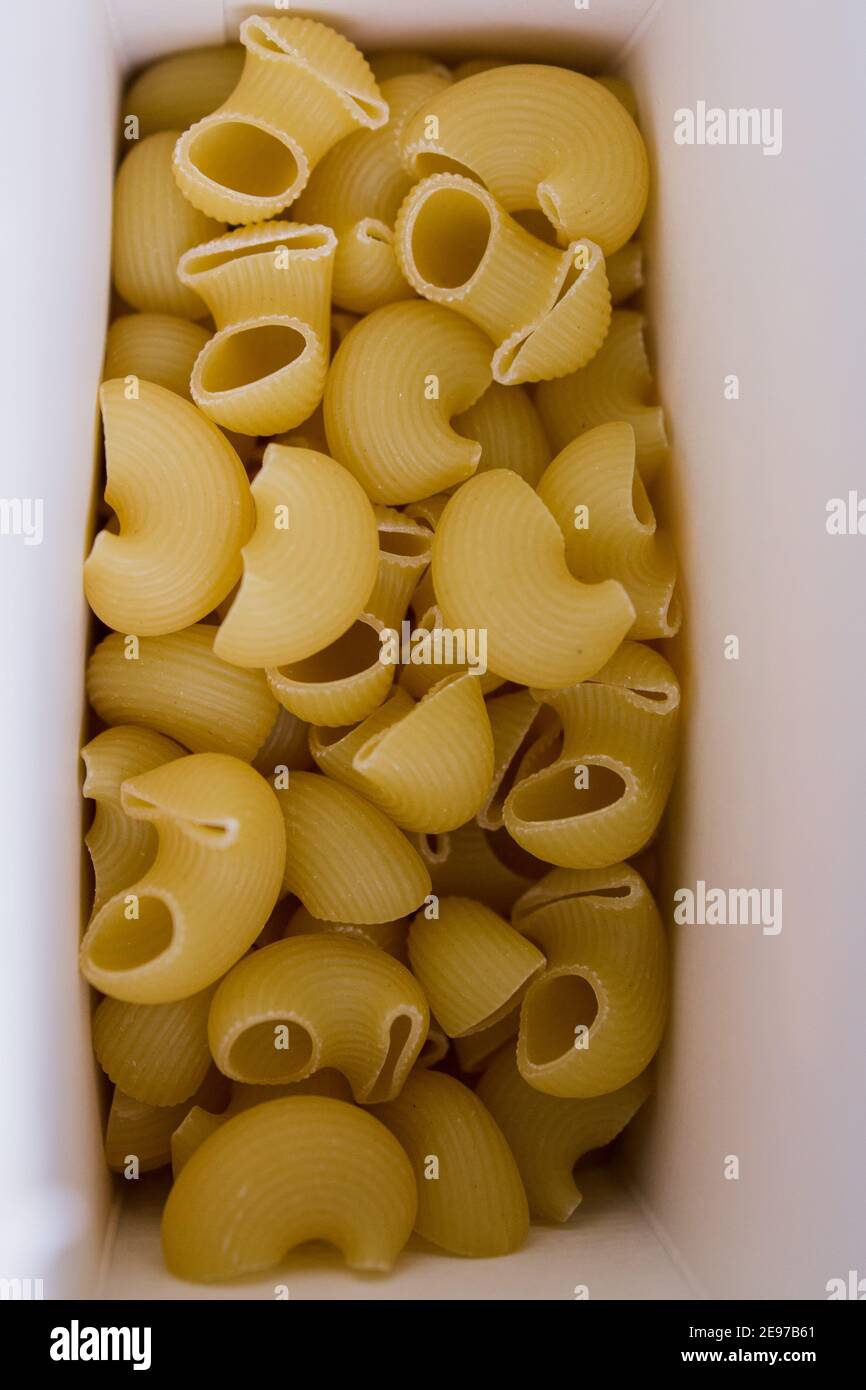 a fresh raw durum pasta in white box in kitchen Stock Photo - Alamy