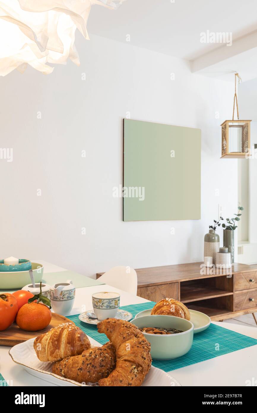 Close up of elegant and romantic white table ready for breakfast with ...