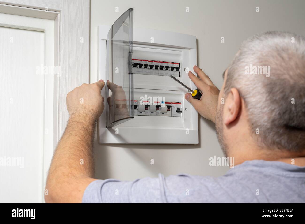 Electricity distribution box. Fuse box. man doing electrical work Stock ...
