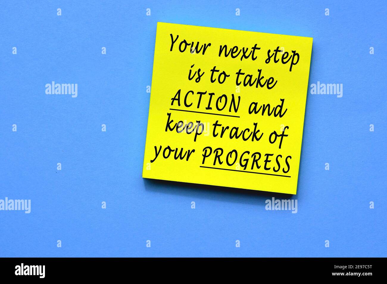 Text on yellow sticky note with blue background Stock Photo - Alamy