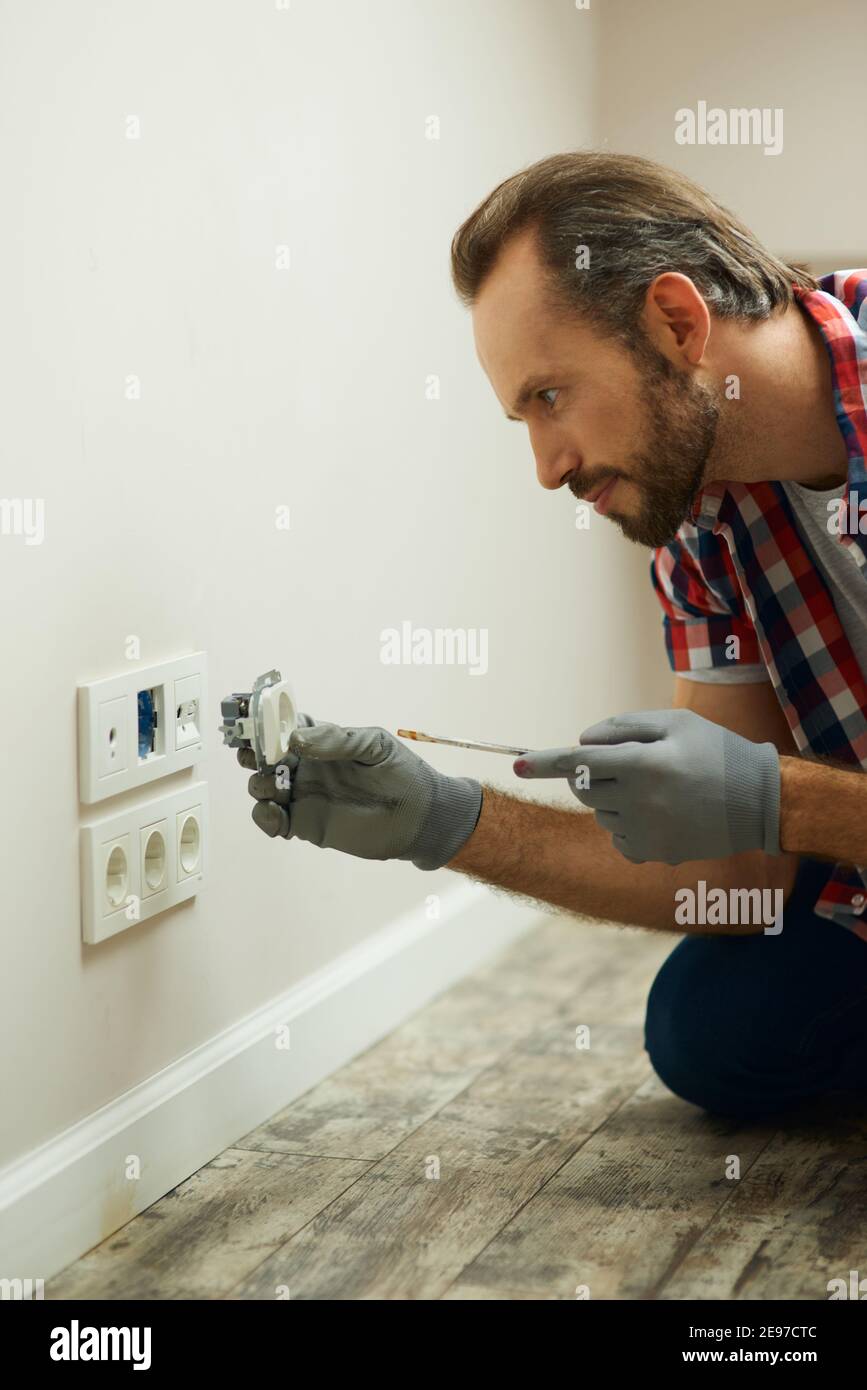 Using a wall socket hi-res stock photography and images - Alamy