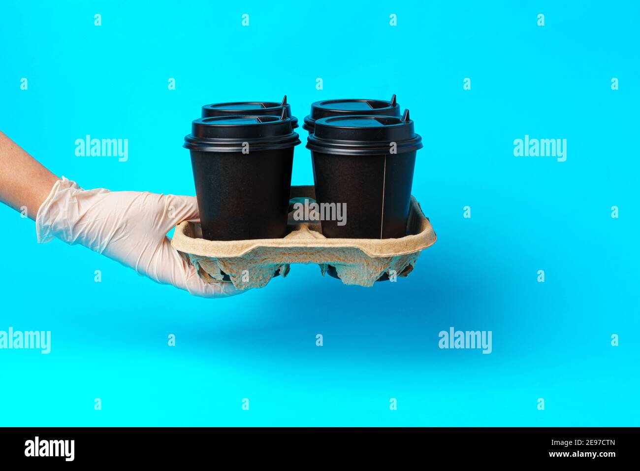 Coffee delivery. Human hand holding takeaway coffee cup Stock Photo - Alamy