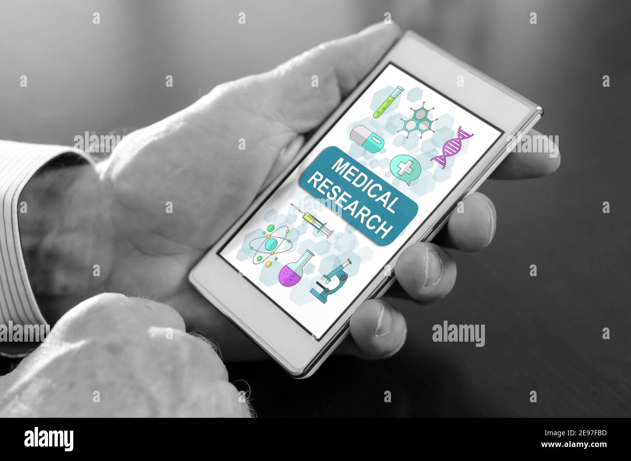 Hand holding a smartphone with medical research concept Stock Photo - Alamy