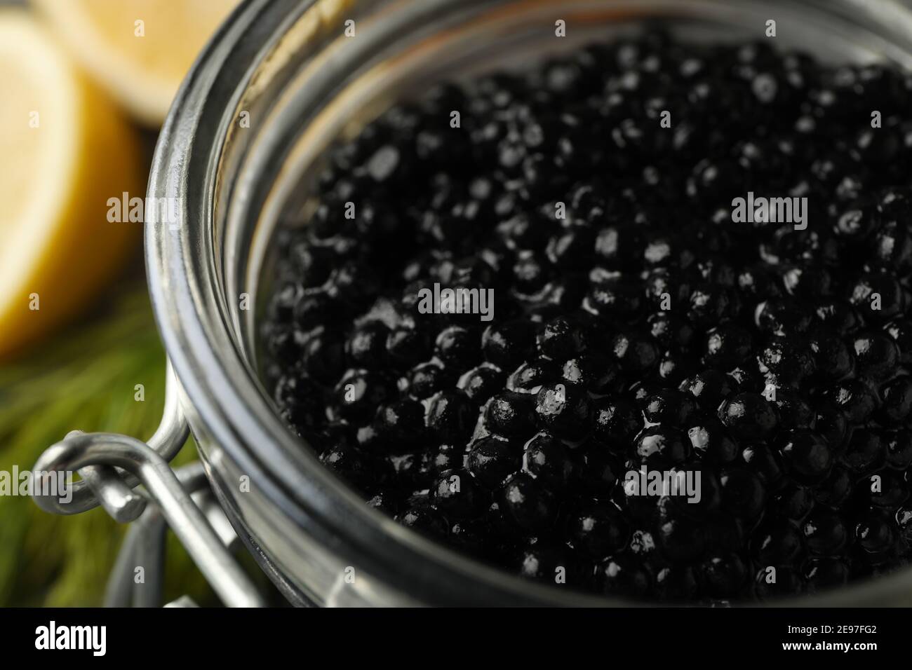 Glass jar with black caviar, close up Stock Photo - Alamy