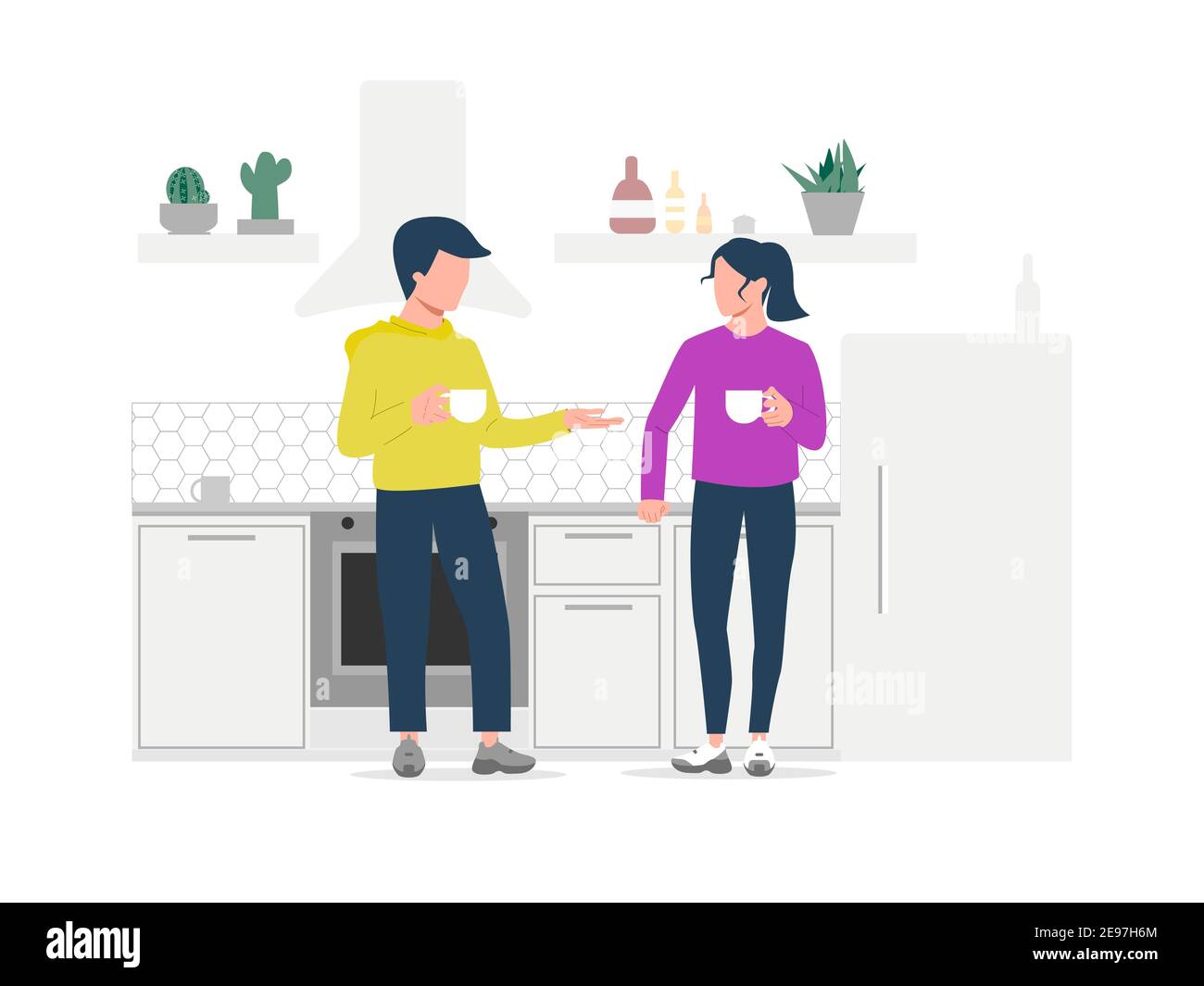 The couple is talking in the kitchen. Young people drink and have a ...