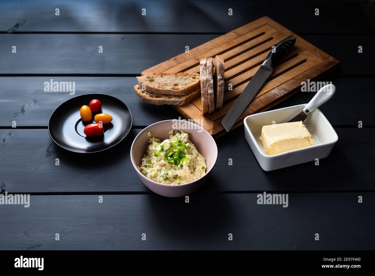 egg paste with bread and cherry tomatoes for breakfast Stock Photo - Alamy