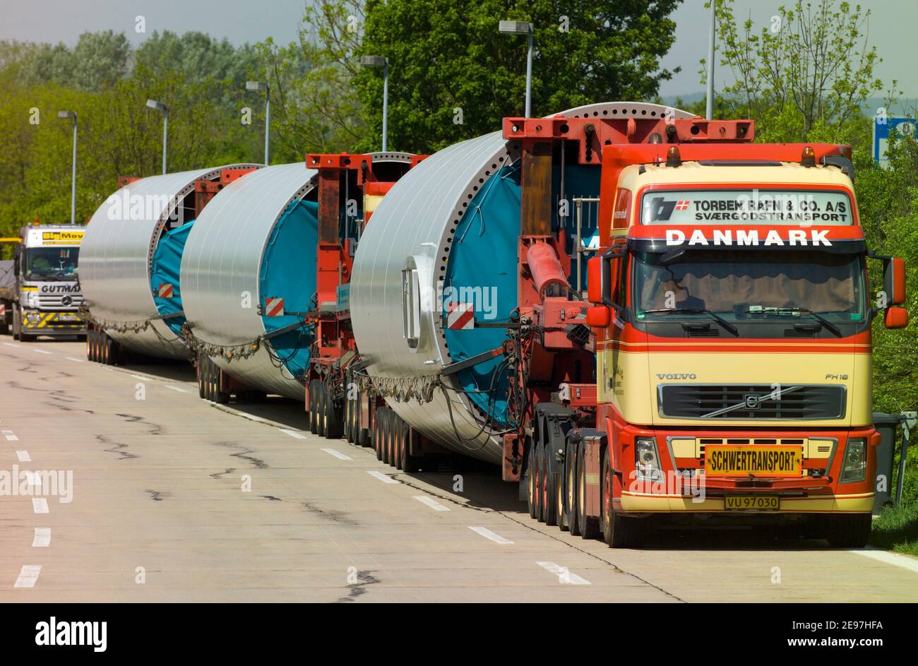 heavy load truck transporting parts of a wind power plant, waiting at ...