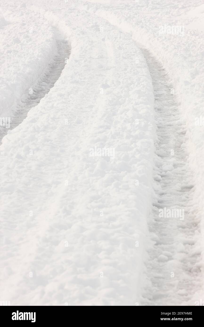 Vehicle ruts in the snow. Frozen road. Off-road drive Stock Photo - Alamy