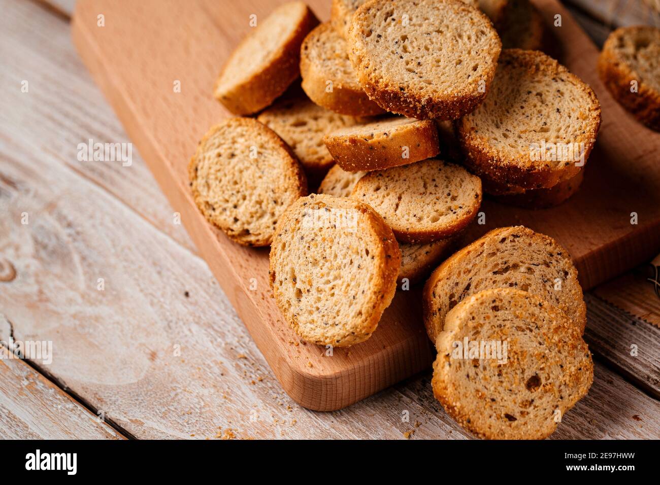 Dried bread crackers on the wooden background Stock Photo - Alamy