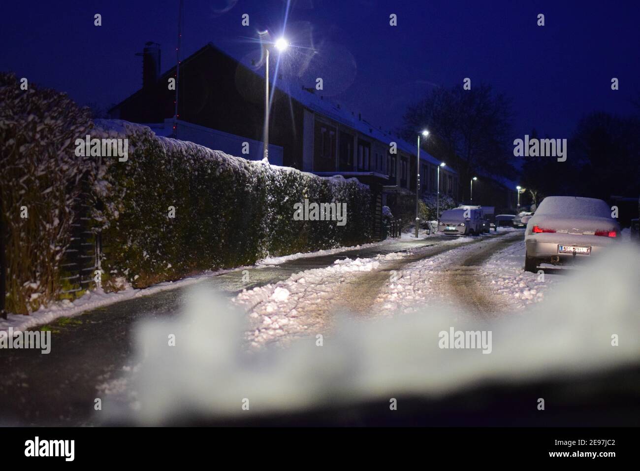 View through windshield on wintry road with snow on the hood Stock ...