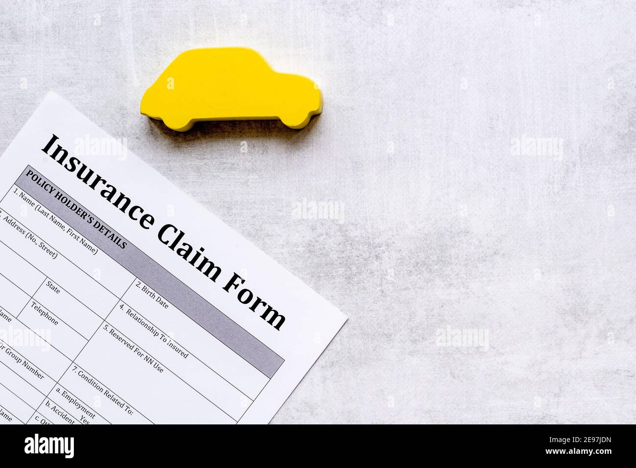 Insurance claim form with car shape. Top view Stock Photo - Alamy