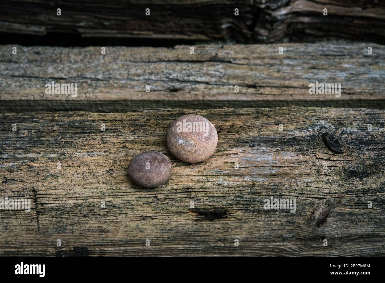 Old wooden boards with two beautiful rocks in it Stock Photo - Alamy