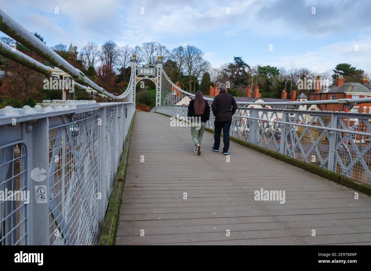 Chester; UK: Jan 29, 2021: 2 people walk together across the pedestrian ...