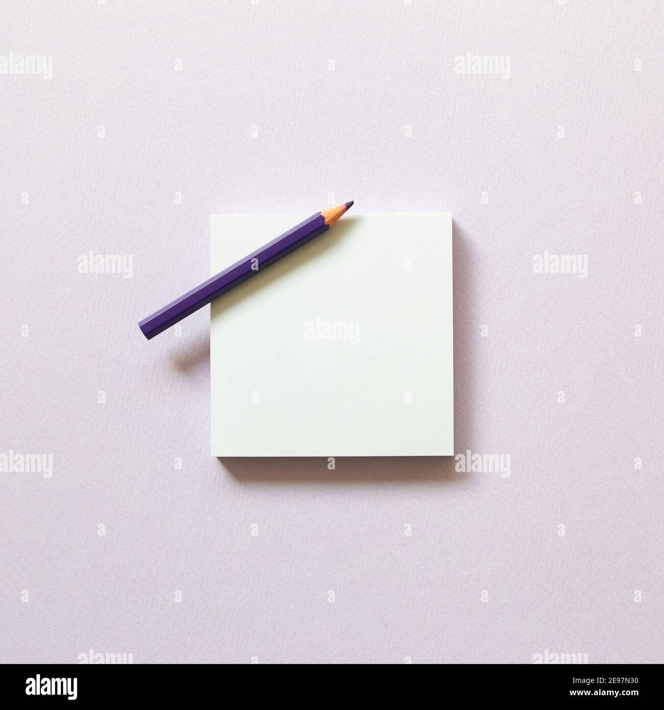 Memo paper, sticky notes with colored pencil on purple background. top ...