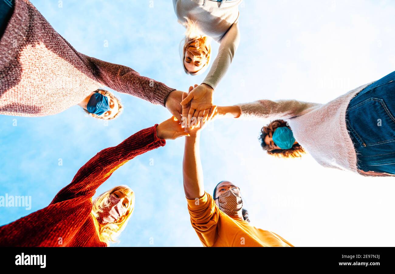 College students teamwork stacking hands - New normal lifestyle concept ...