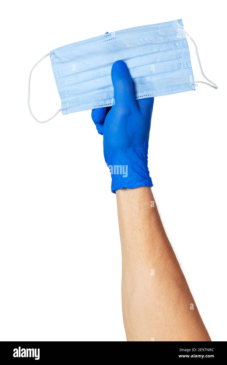 Hand in gloves hold a mask isolated on white background Stock Photo - Alamy