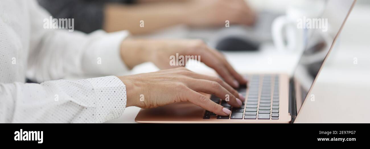 Laptops on desk office hands hi-res stock photography and images - Alamy