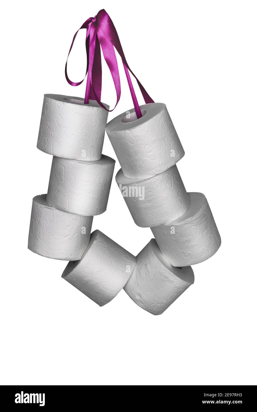 Rolls of white toilet paper are connected with a ribbon in a bundle ...