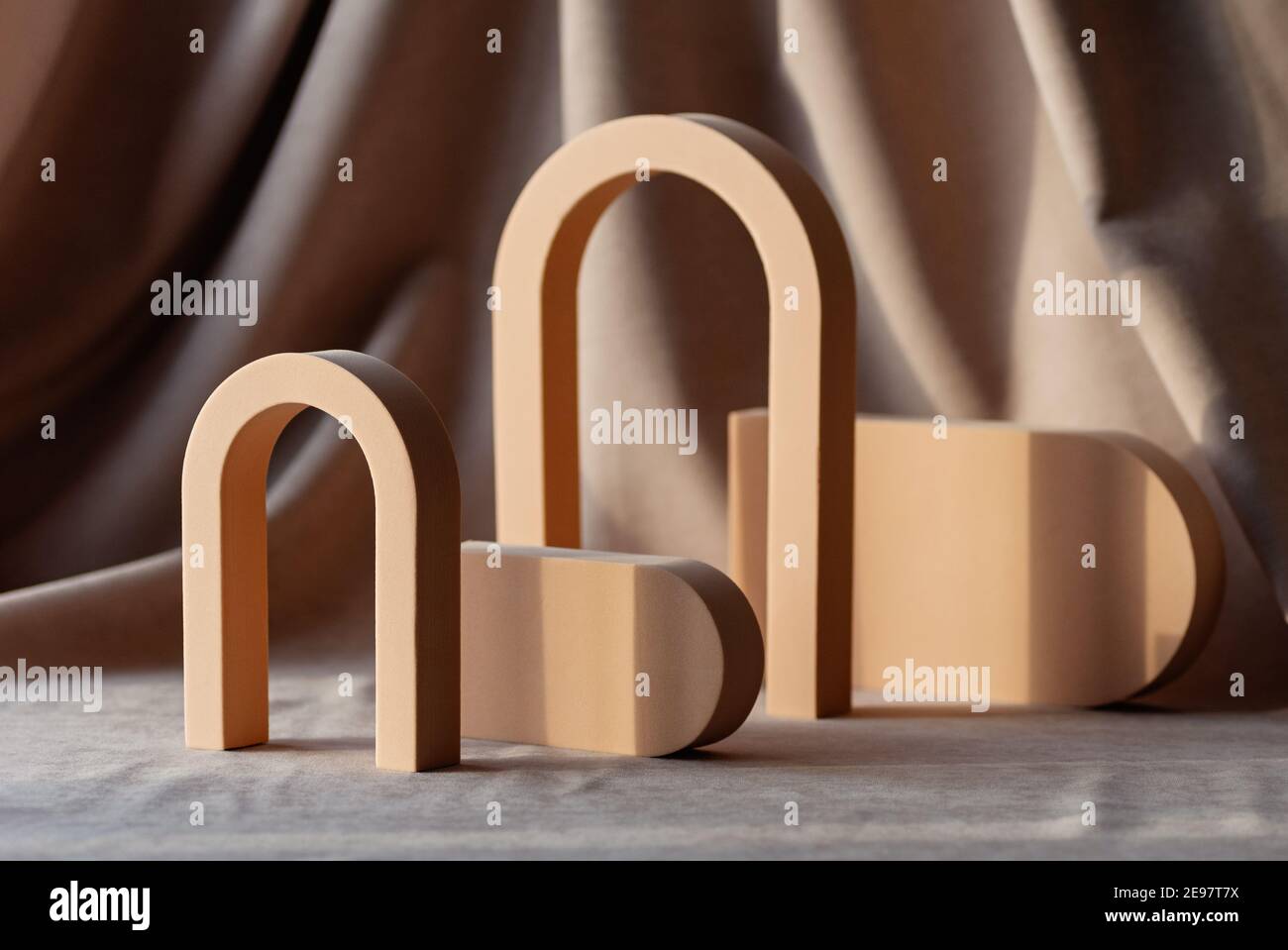 Abstract monochromatic composition with geometric figures against beige ...