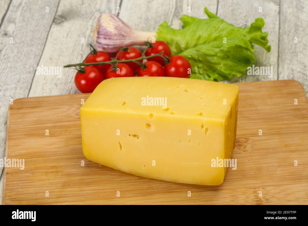 Swiss Hard yellow tasty cheese brick Stock Photo - Alamy