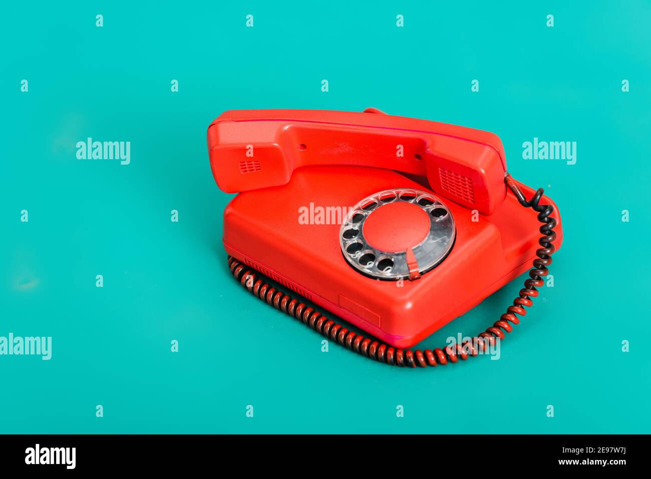 bright red vintage landline phone on turquoise background Stock Photo ...