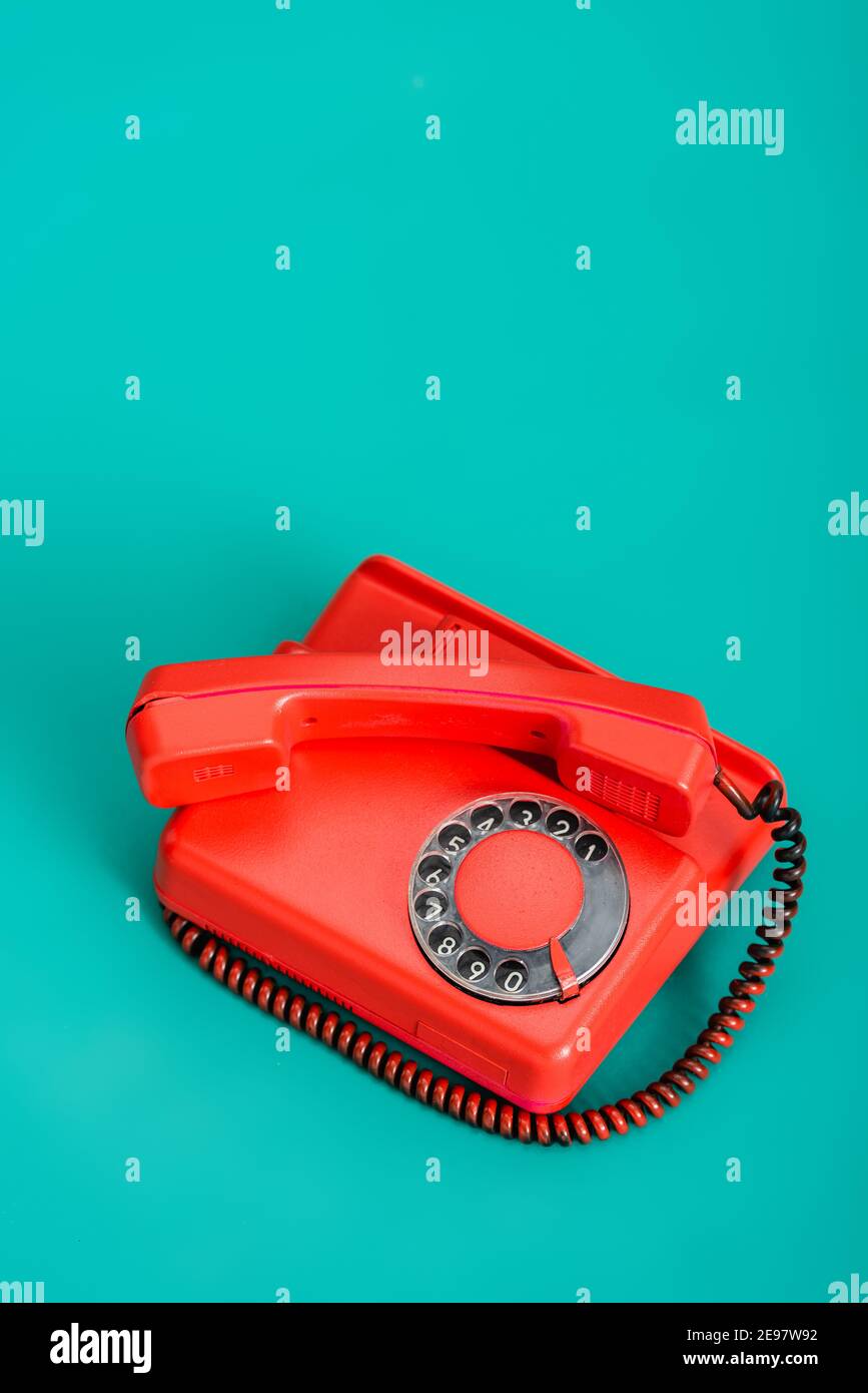 vintage landline phone on turquoise background Stock Photo - Alamy