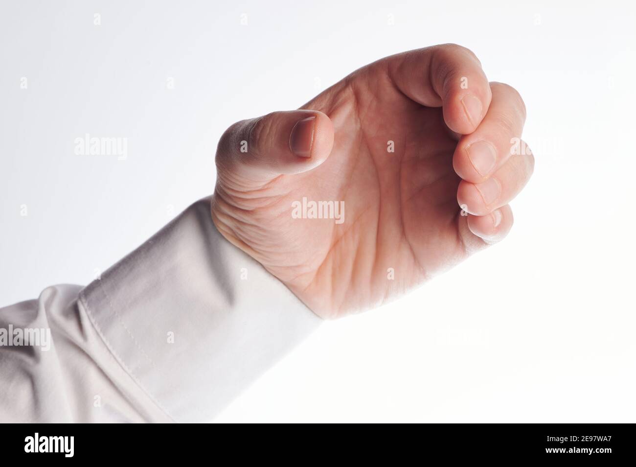 Hand in holding bottle pose isolated on white studio background Stock ...