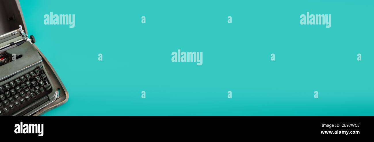 retro typewriter on turquoise background with copy space, banner Stock ...