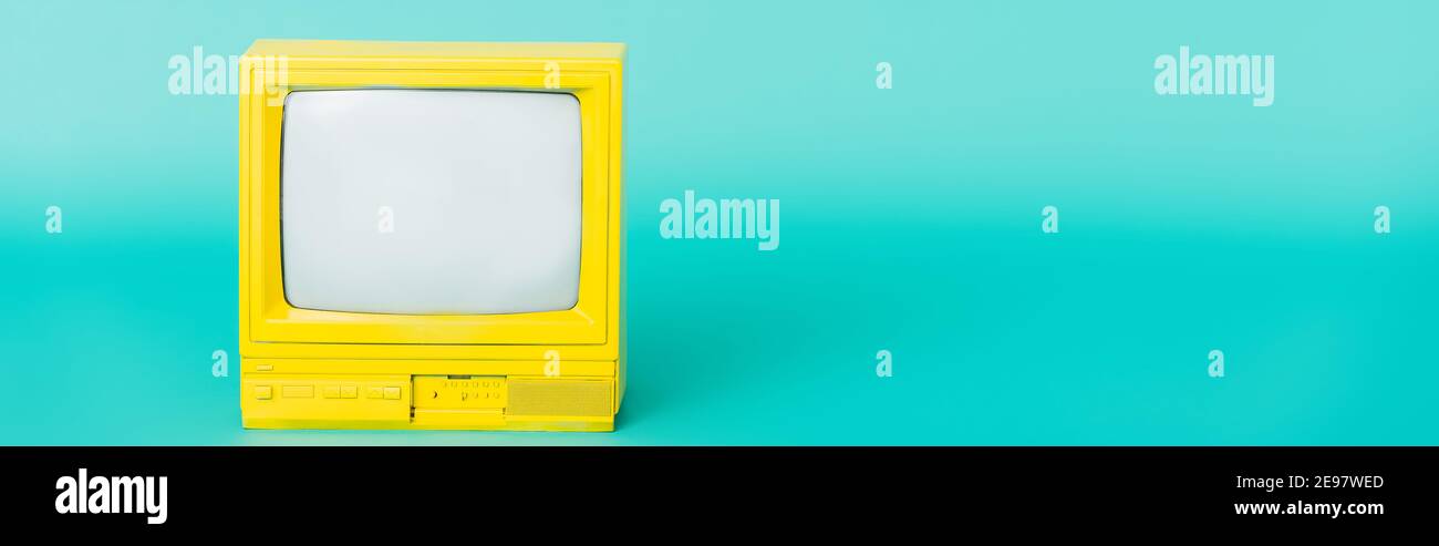 bright yellow retro tv set on turquoise background, banner Stock Photo ...