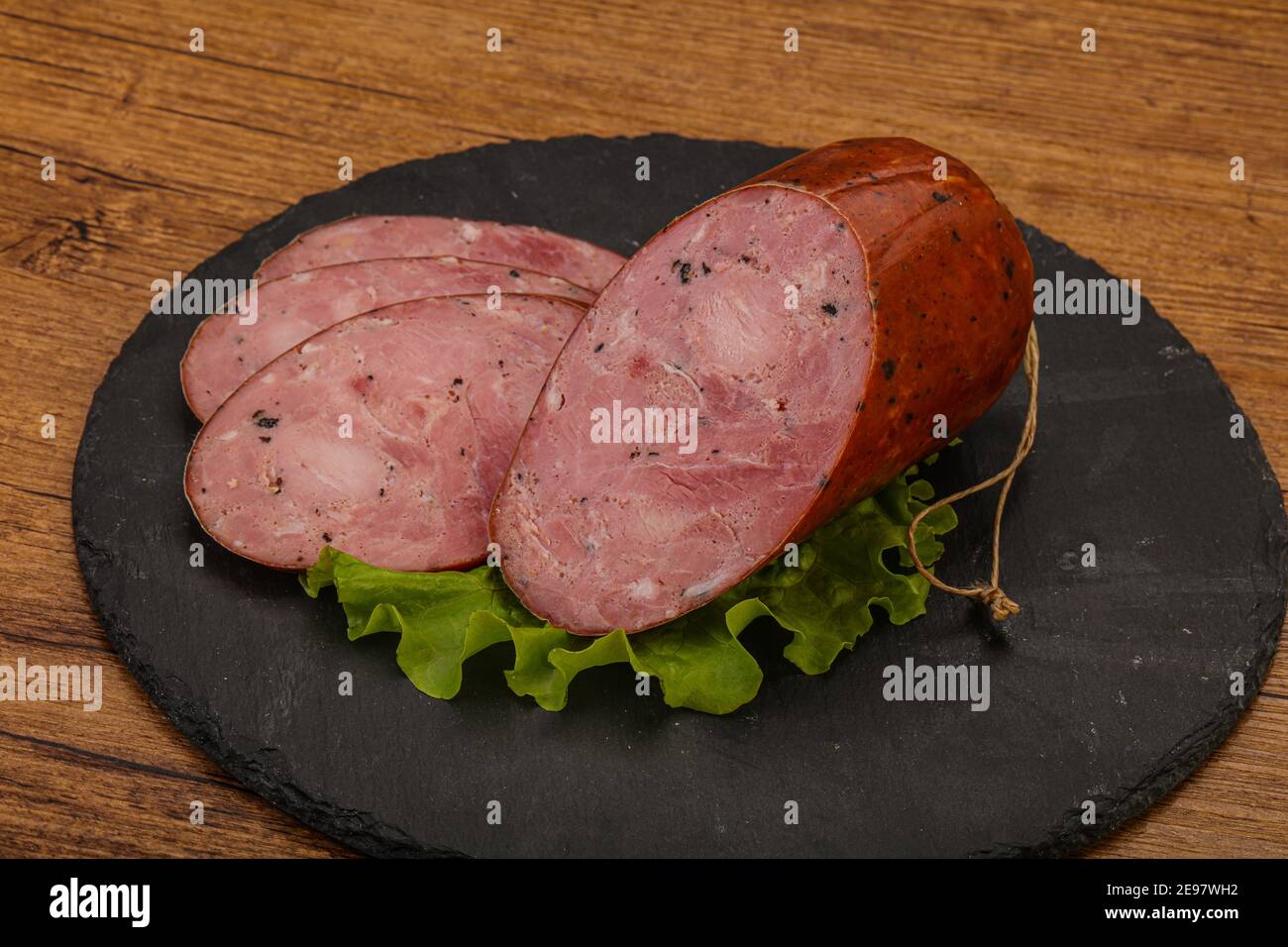 Smoked ham sausage with spices and herbs Stock Photo - Alamy