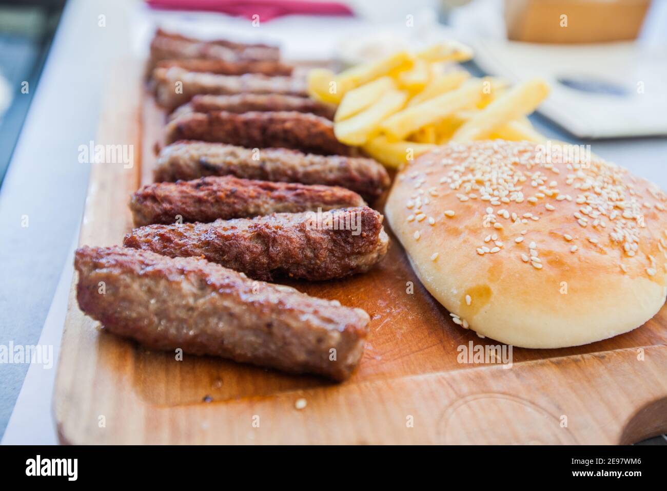 Grilled minced meat. Traditional Balkan food. Served with french fries ...