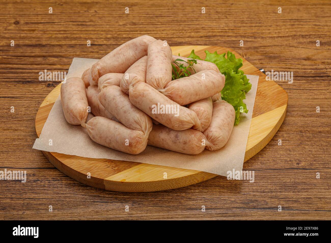Raw natural chicken baby sausages for roast Stock Photo - Alamy