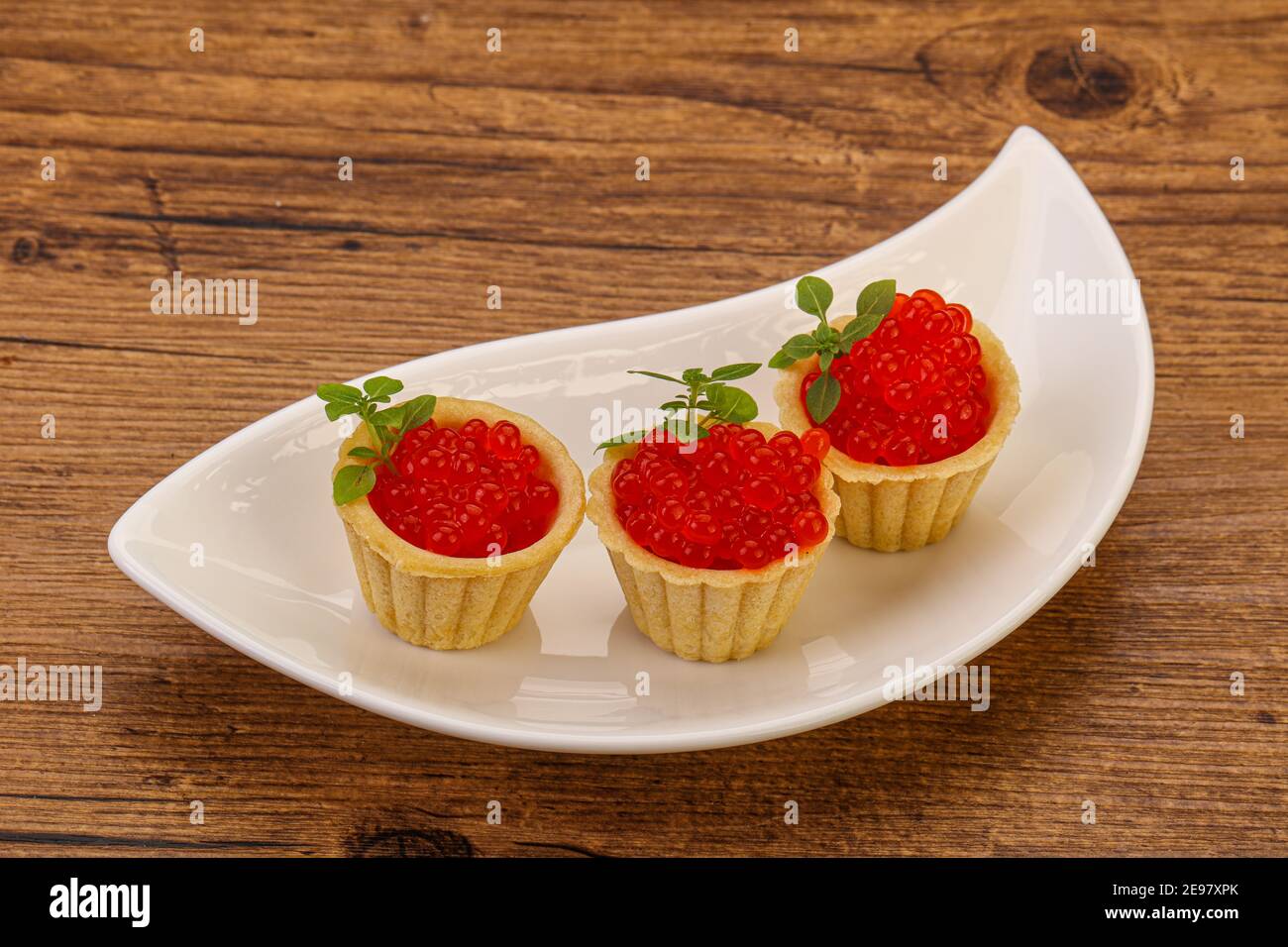 Apetizer - tartlet with red caviar snack Stock Photo - Alamy