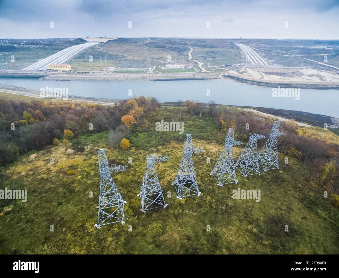 Power line supports. Electricity transmission and posts. New power line ...