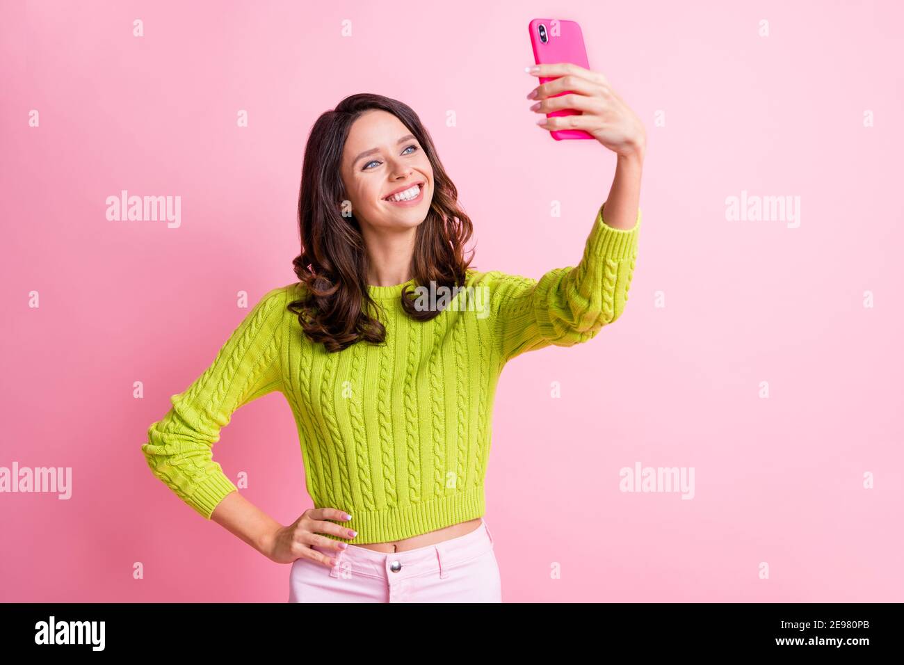 Photo of positive girl hold telephone make selfie toothy smile wear ...