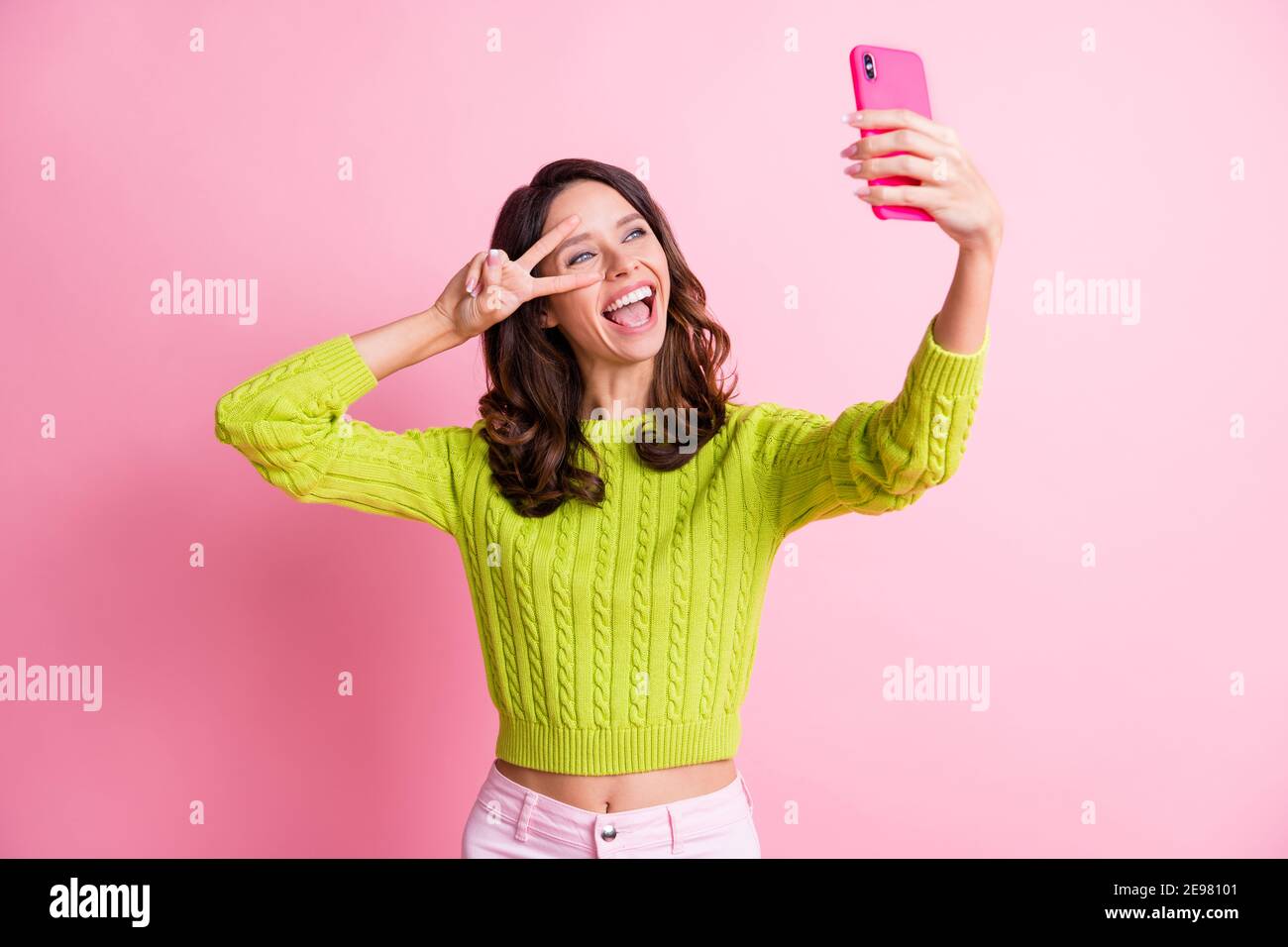 Photo of funky lady hold cellphone shoot selfie show v-sign near eye ...