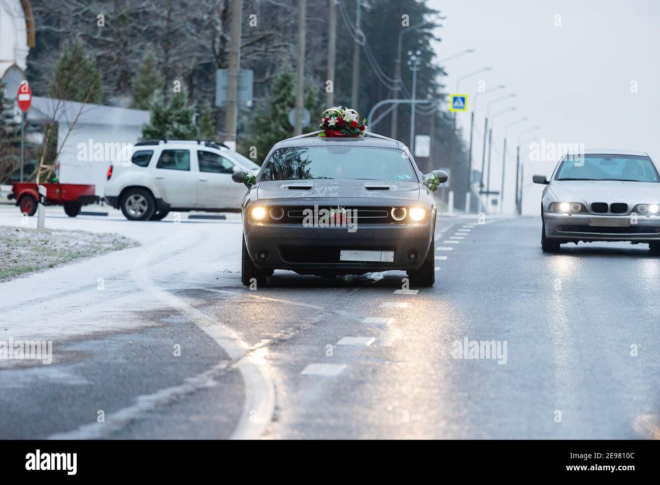 the car is driving on a winter snow-covered highway, bad weather ...