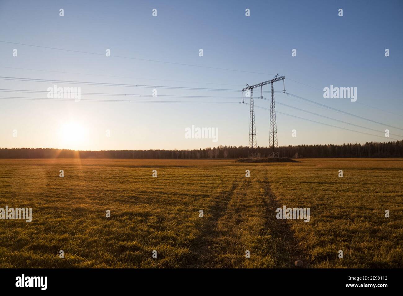 Power line supports. Electricity transmission and posts Stock Photo - Alamy
