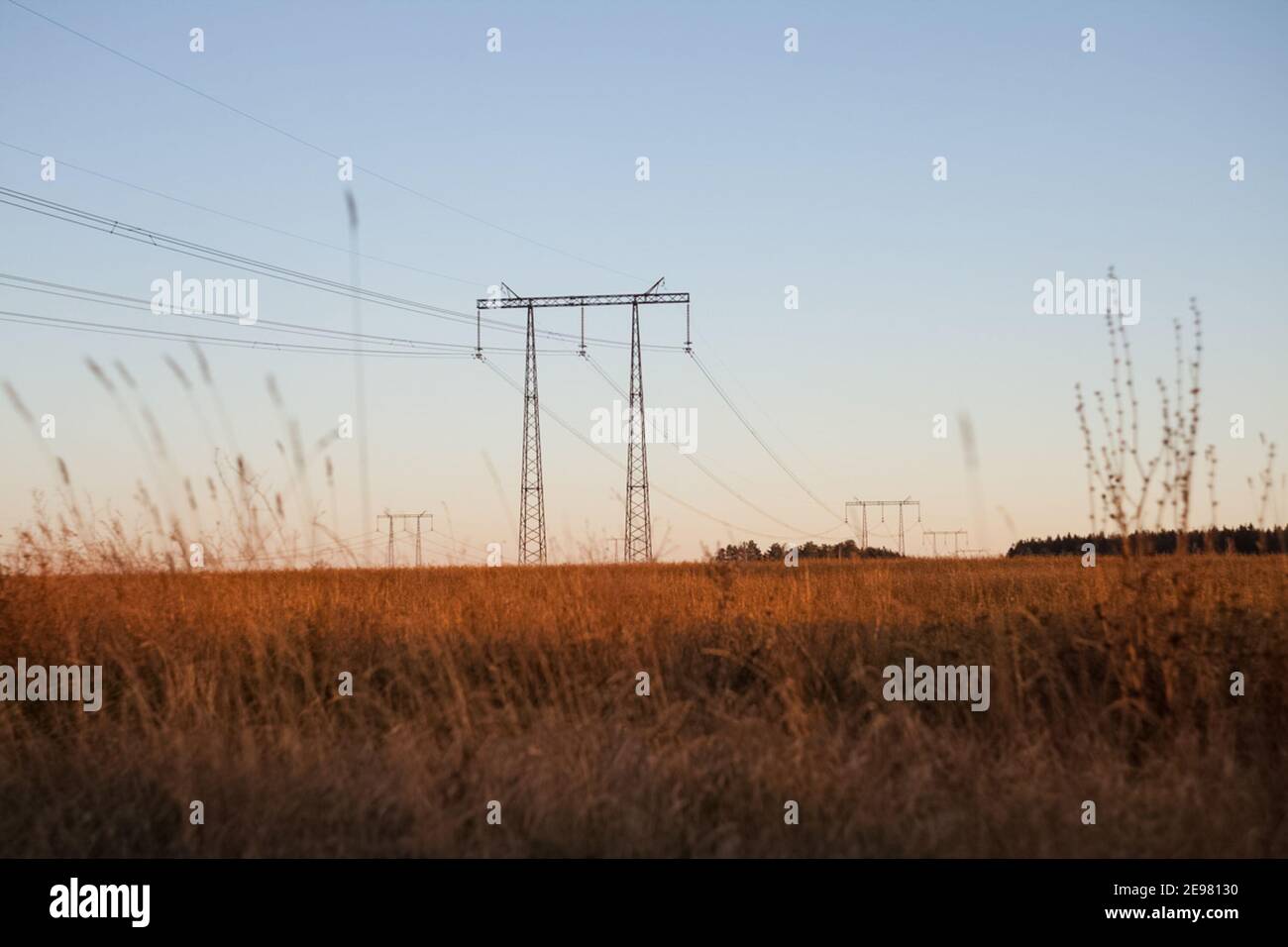Power line supports. Electricity transmission and posts Stock Photo - Alamy