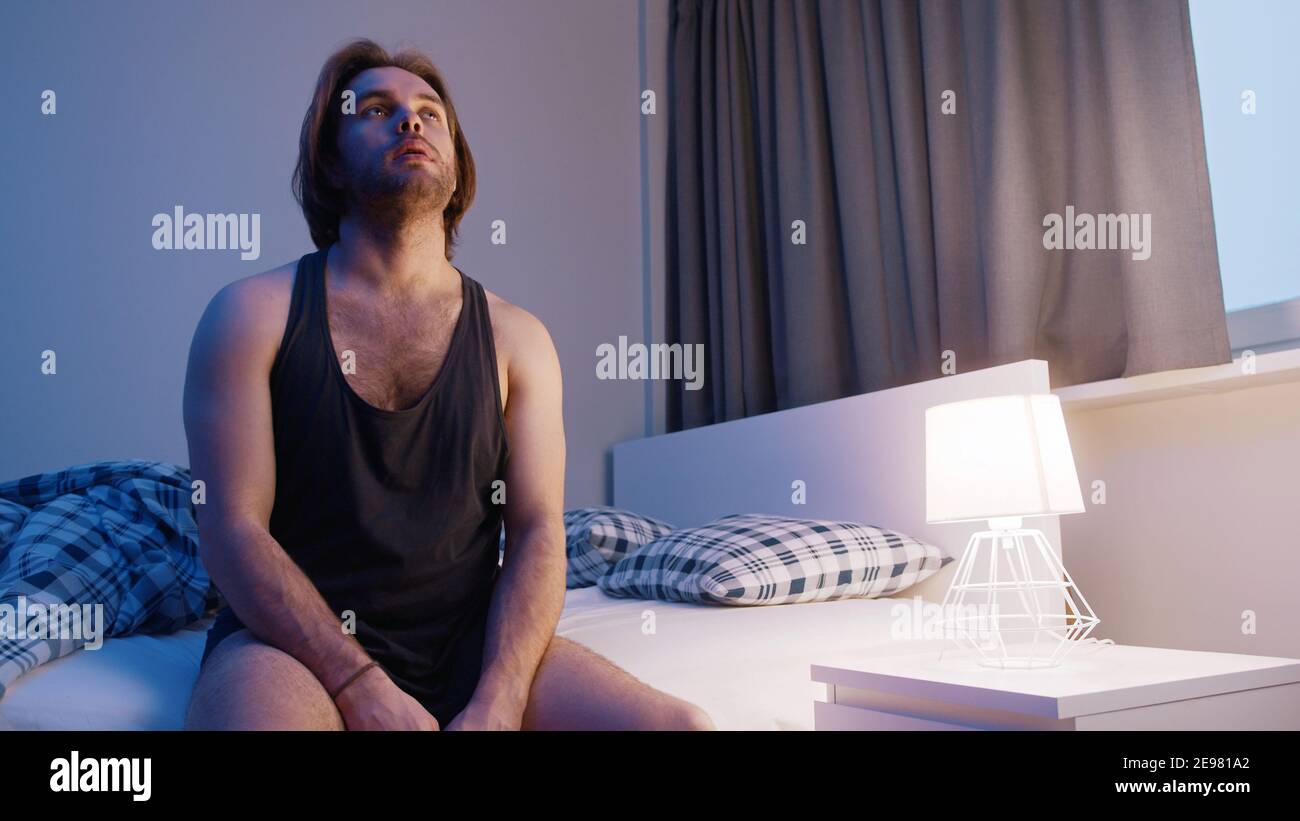 Man sitting up in bed hi-res stock photography and images - Alamy