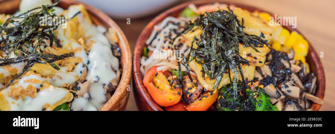 Raw Organic Poke Bowl with Rice and Veggies close-up on the table. Top ...