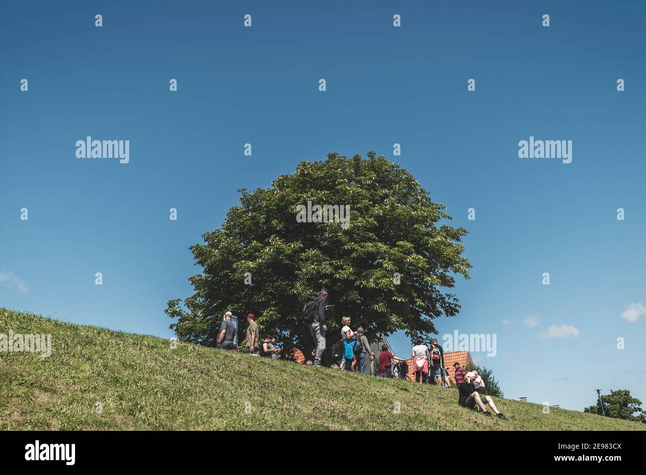 People on the flood embankment, Greetsiel, Lower Saxony, Germany ...