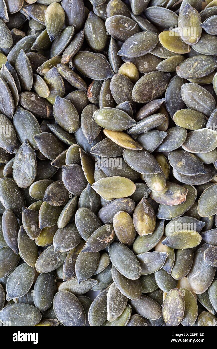 close-up of pumpkin seeds, macrophotography, food background, full ...
