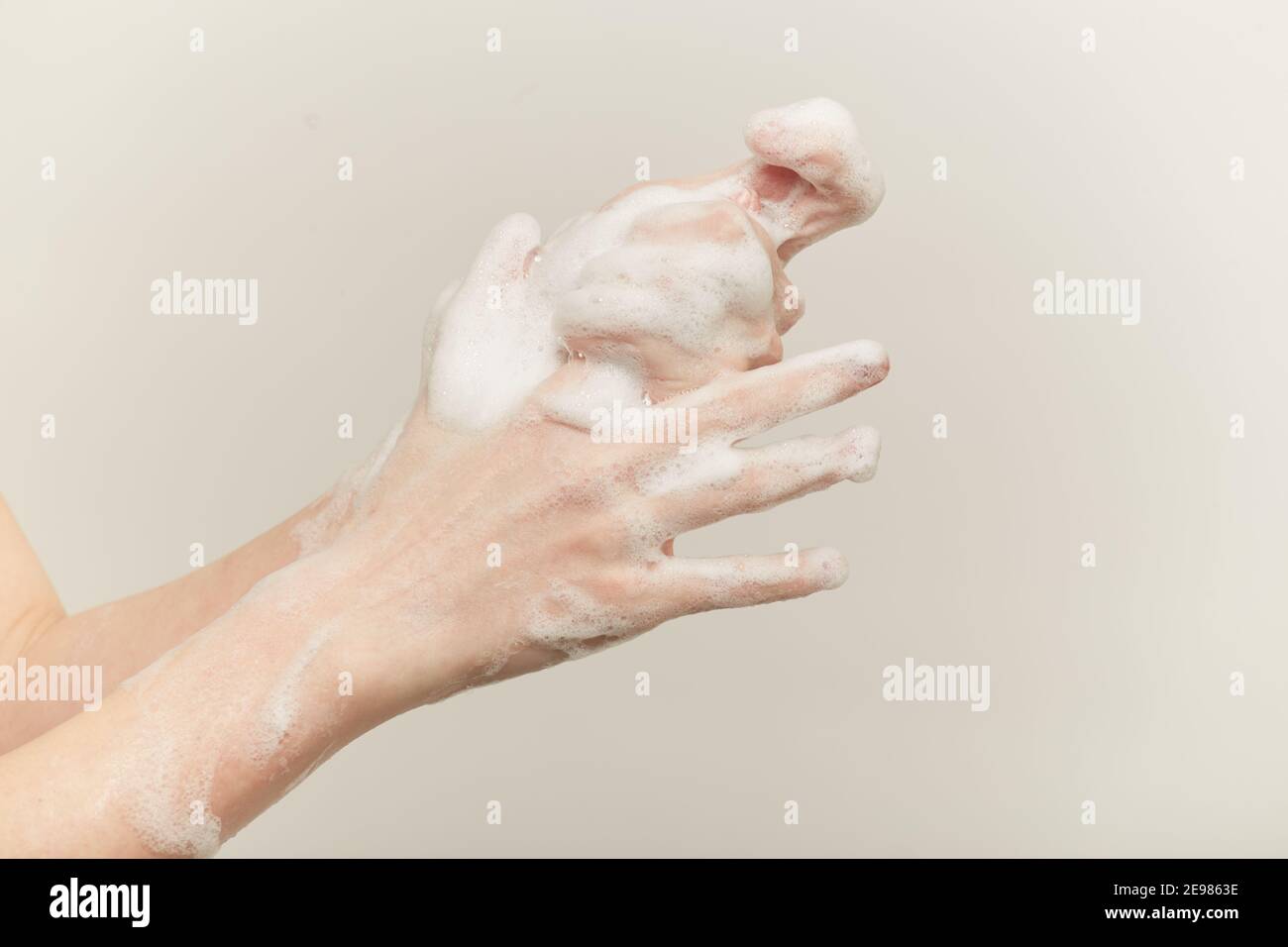 woman washing her arms closeup side view on white background Stock ...
